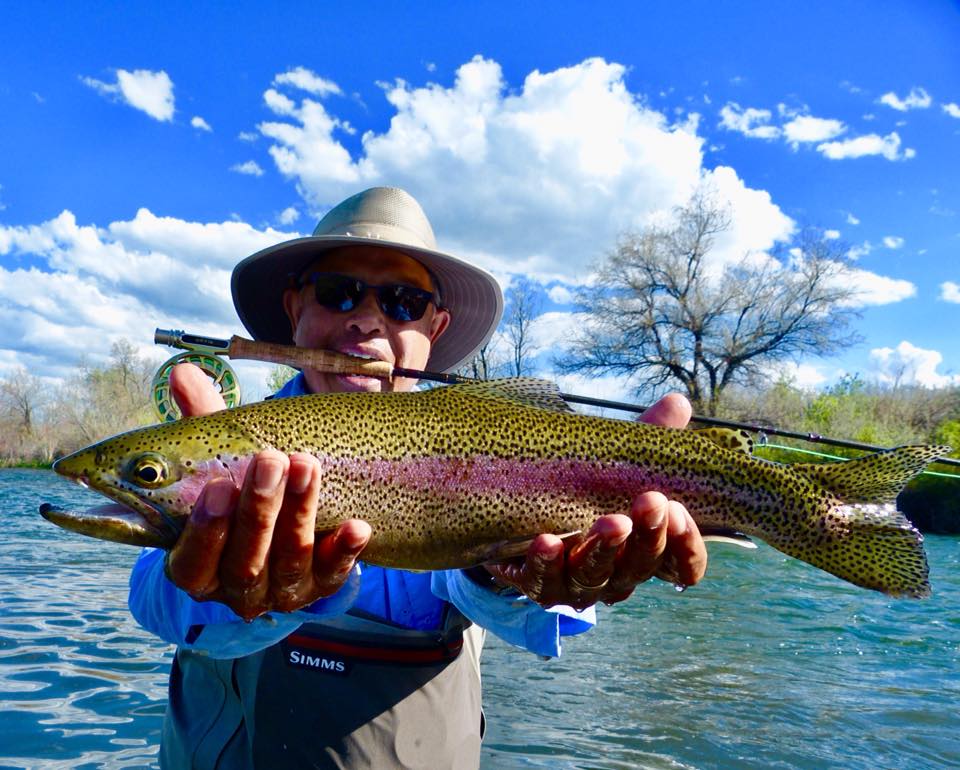 Ray with a very nice rainbow. - Montana Fly Fishing & Bird Hunting